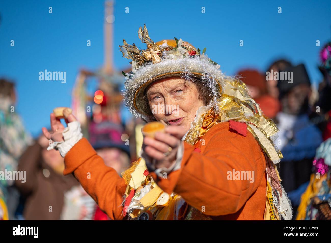 A woman performs during Twelfth Night celebration. People gathered to ...