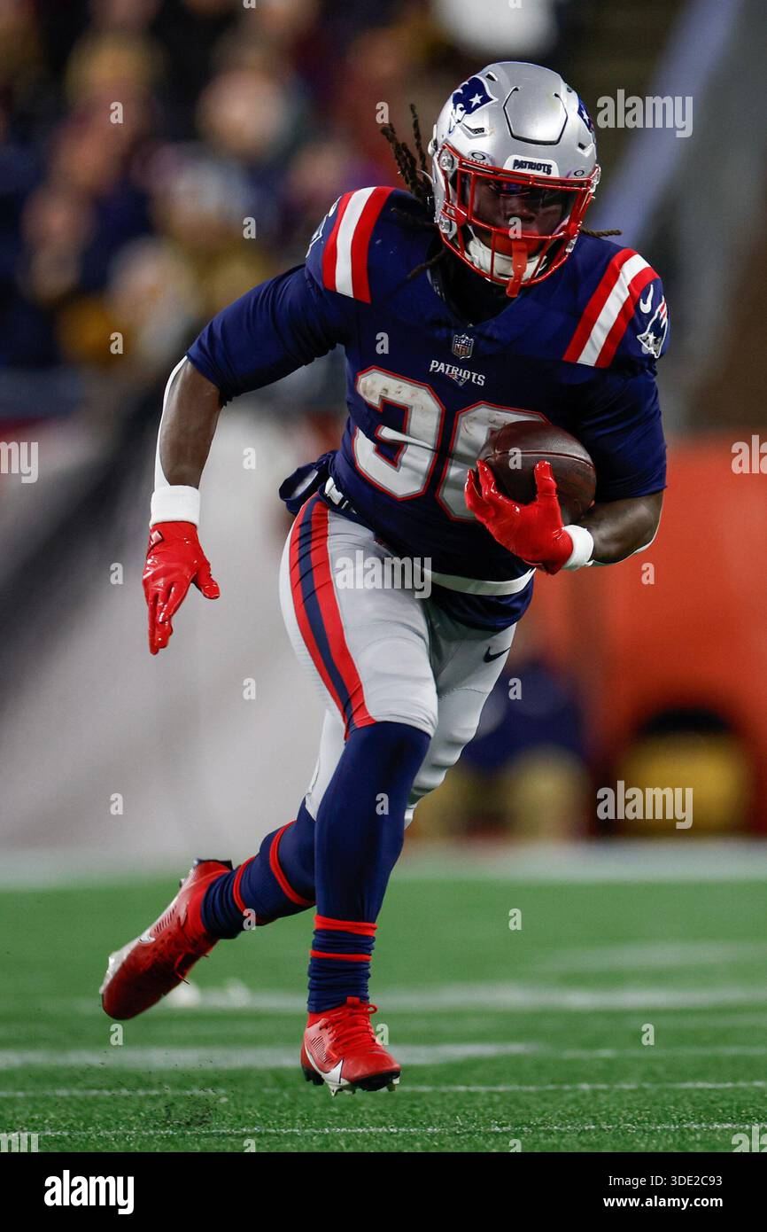 New England Patriots running back Rhamondre Stevenson (38) carries the ...