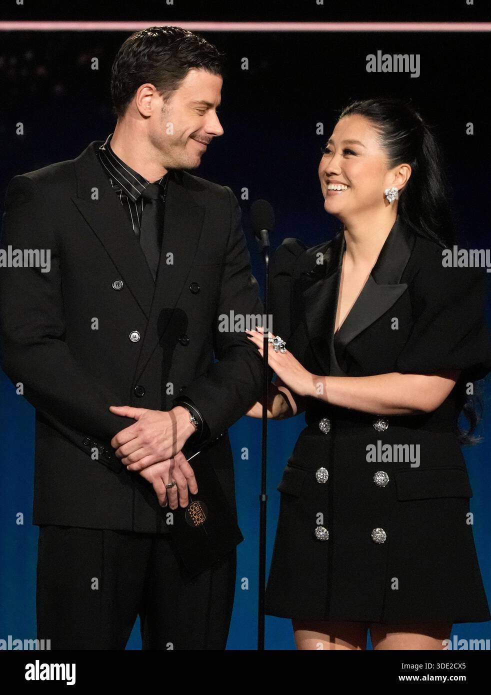 Francois Amaud, left, and Sherry Cola present the award for best ...