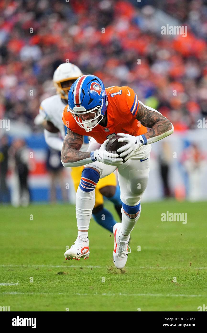 Denver Broncos tight end Evan Engram (1) runs with the ball against the ...