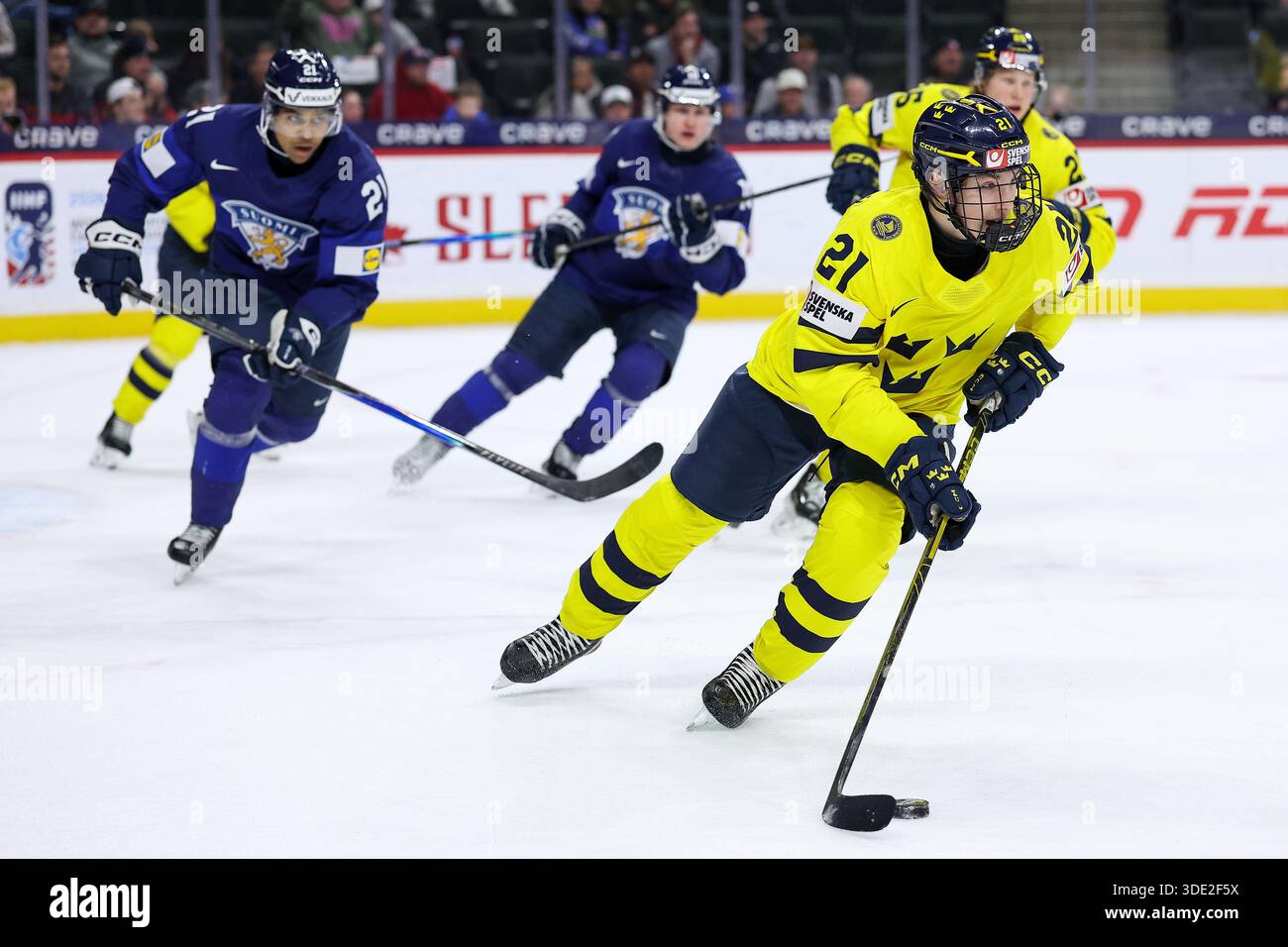 Sweden defenseman Viggo Bjorck (21) skates with the puck against ...