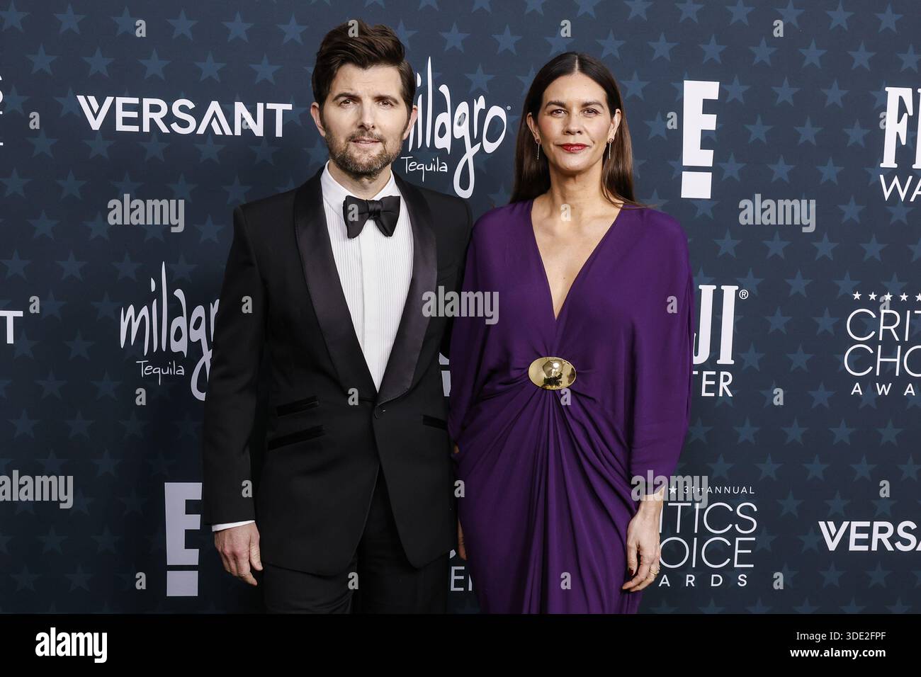 Adam Scott and Naomi Sablan walking on the red carpet at the 31st ...