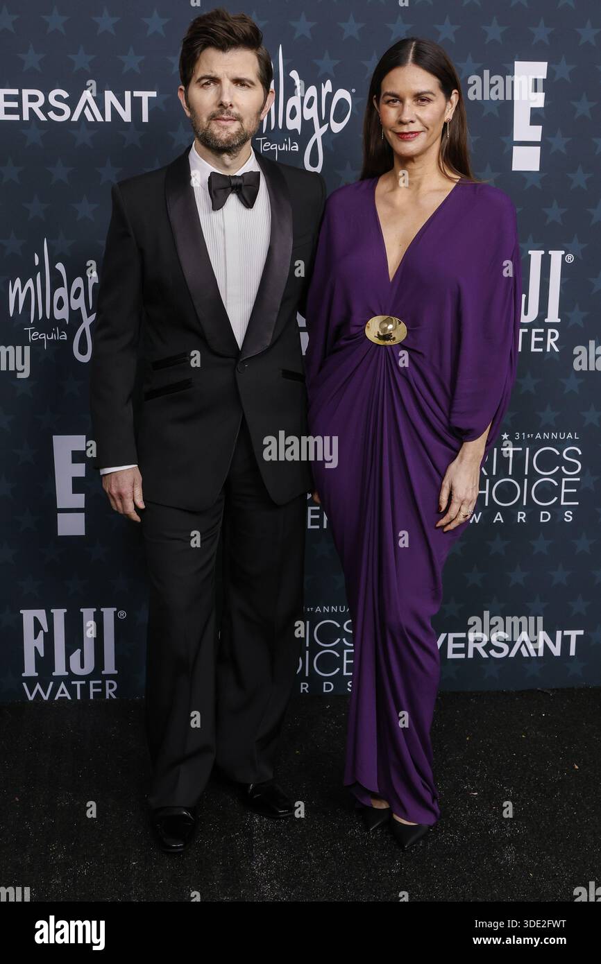 Adam Scott and Naomi Sablan walking on the red carpet at the 31st ...