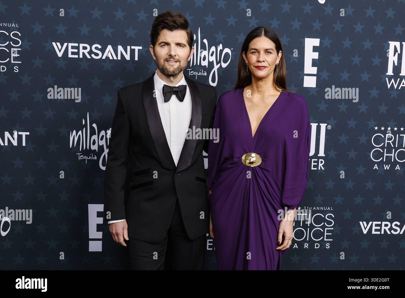Adam Scott and Naomi Sablan walking on the red carpet at the 31st ...