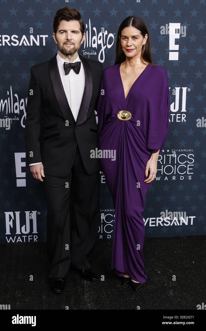 Adam Scott and Naomi Sablan walking on the red carpet at the 31st ...
