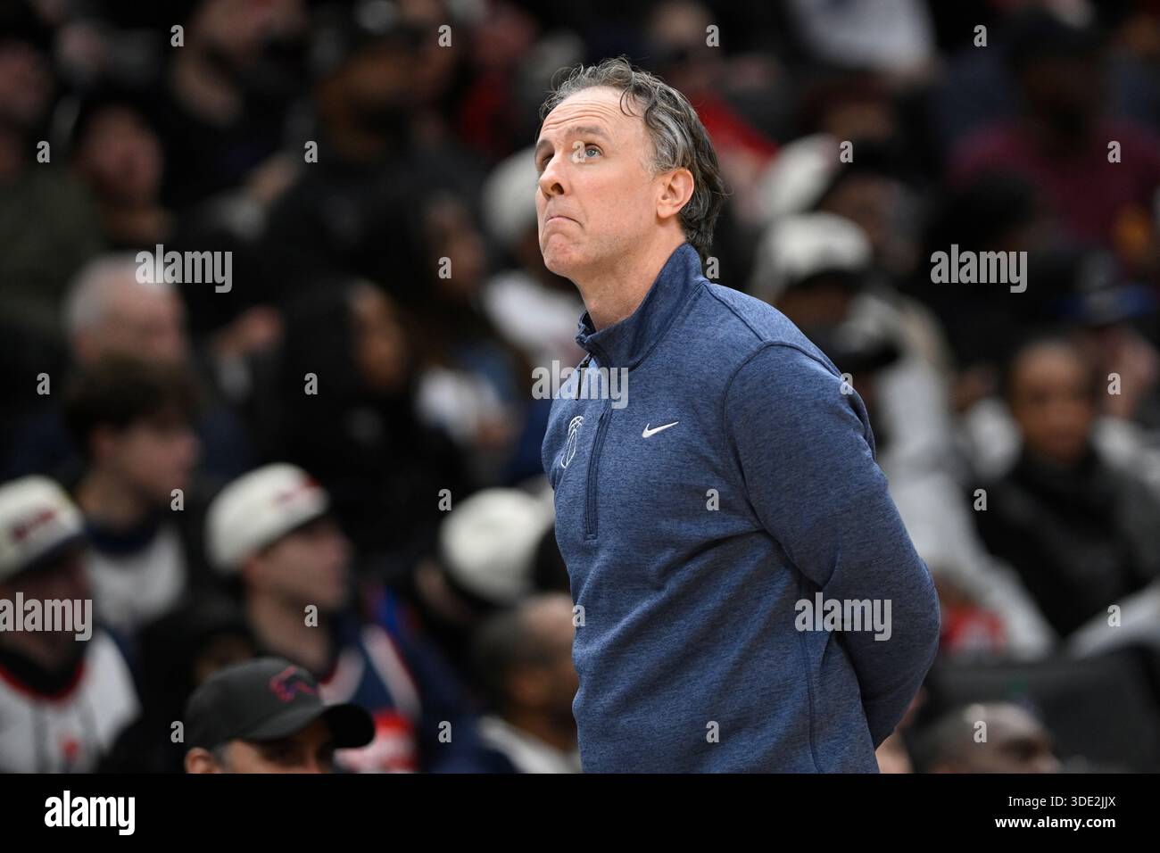 Washington Wizards head coach Brian Keefe check the scoreboard during ...