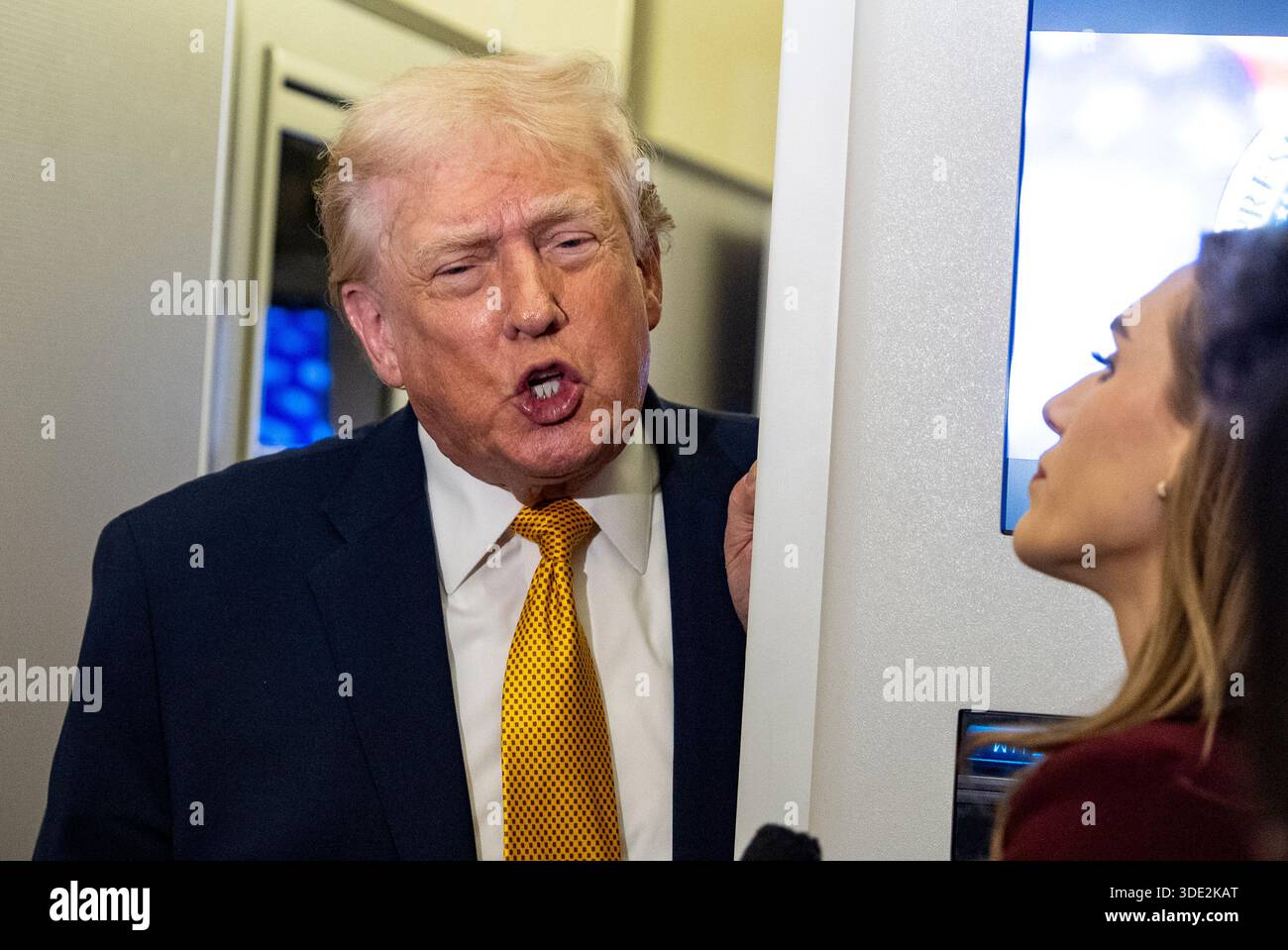 President Donald Trump speaks with reporters while in flight on Air ...