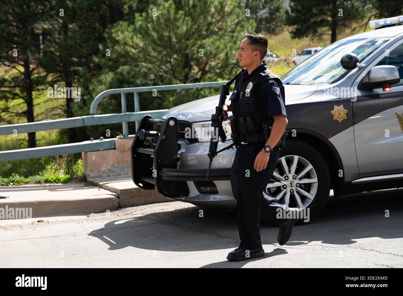Police officers and sheriffs deputies swarm the area around Evergreen ...