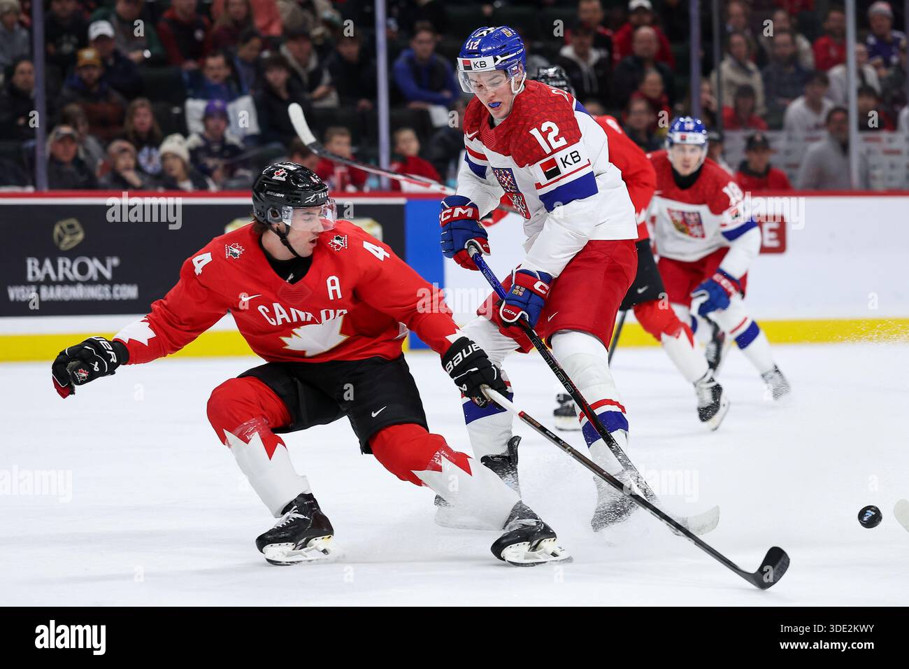 Canada defense Harrison Brunicke, left, defends against Czechia forward ...