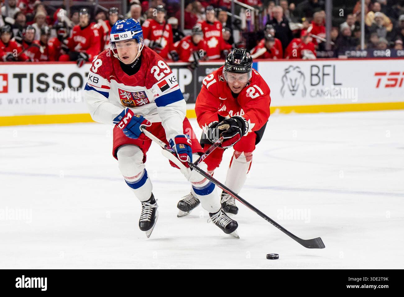 Czechia's Samuel Drancak (29) is defended by Canada's Cole Reschny (21 ...