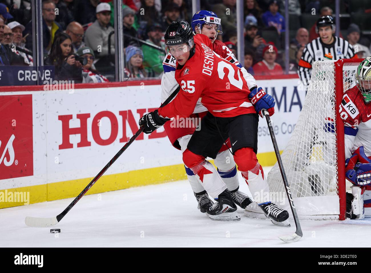 Canada forward Caleb Desnoyers and Czechia defense Max Psenicka compete ...