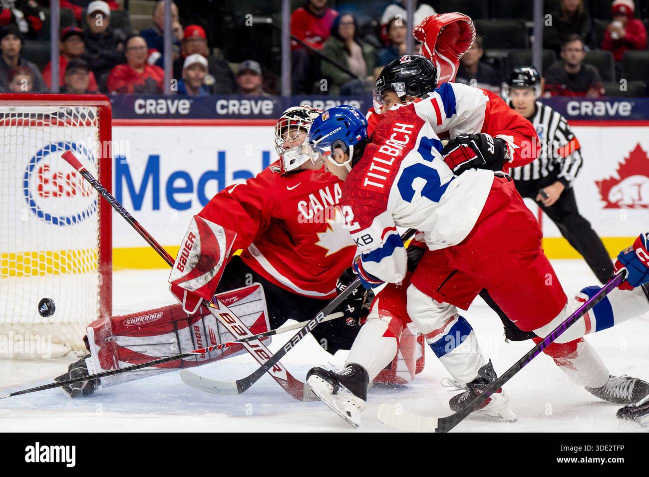 Czechia's Adam Titlbach (22) shoots on Canada goaltender Jack Ivankovic ...