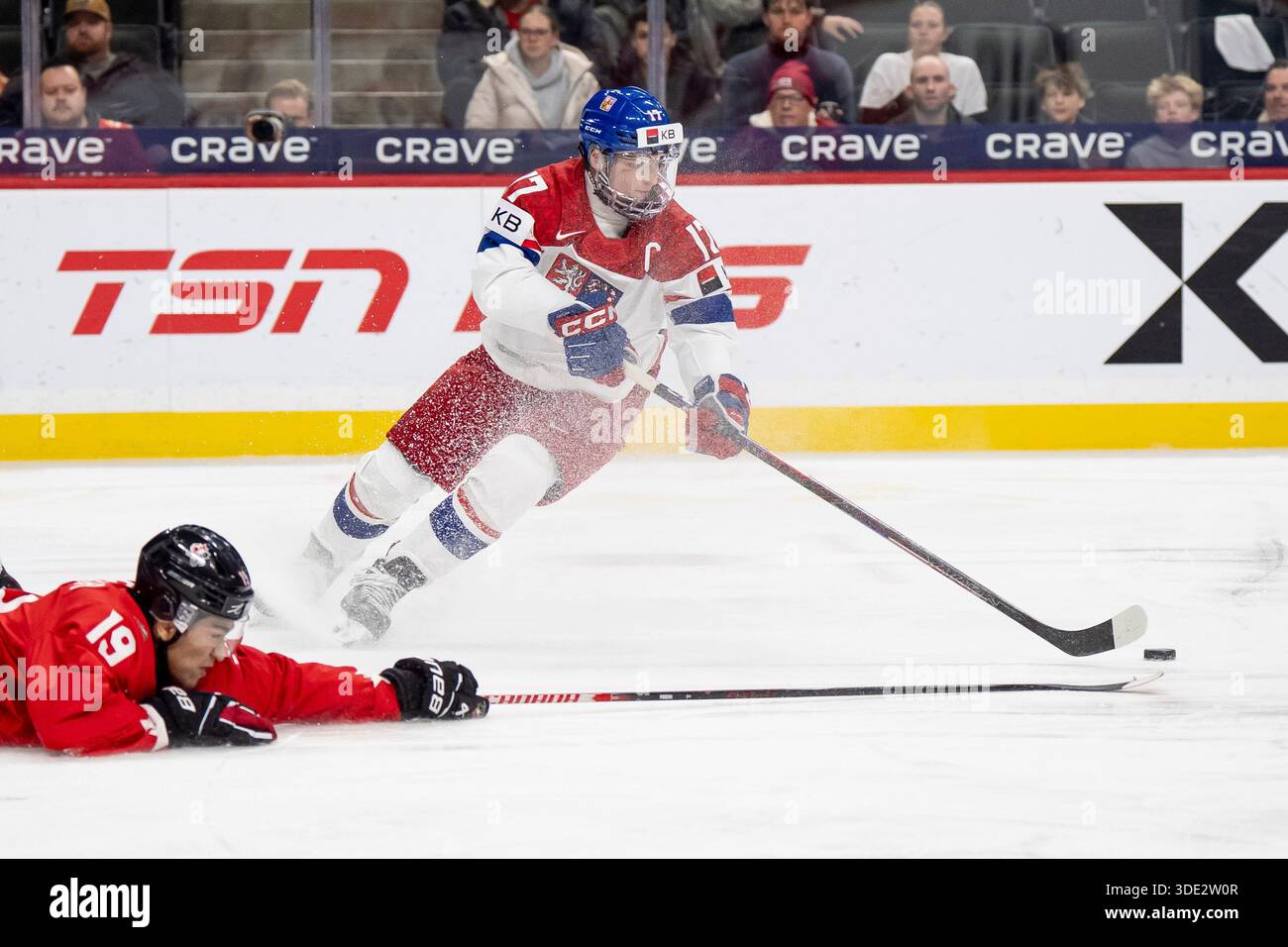 Canada's Jett Luchanko (17) blocks Czechia's Petr Sikora (17) during ...