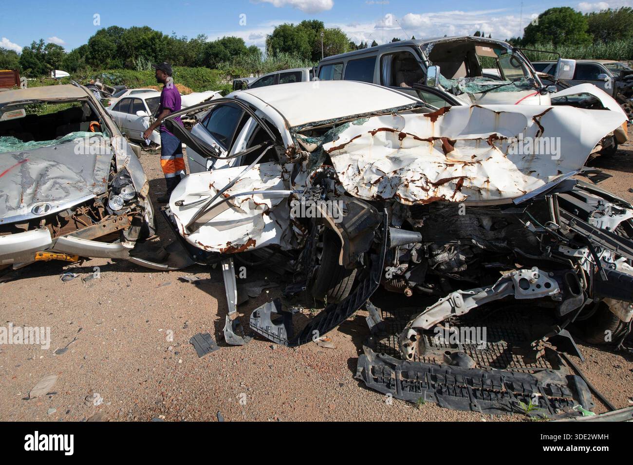 A worker at the vehicle inspection department checks on accident ...