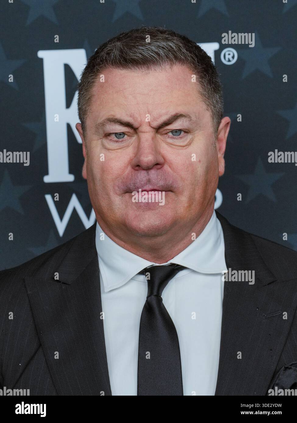 Nick Offerman walking on the red carpet at the 31st Annual Critics ...