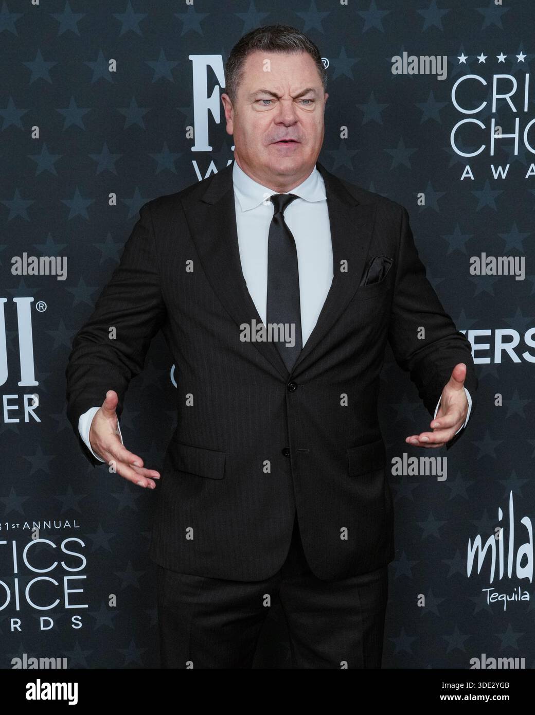Nick Offerman walking on the red carpet at the 31st Annual Critics ...
