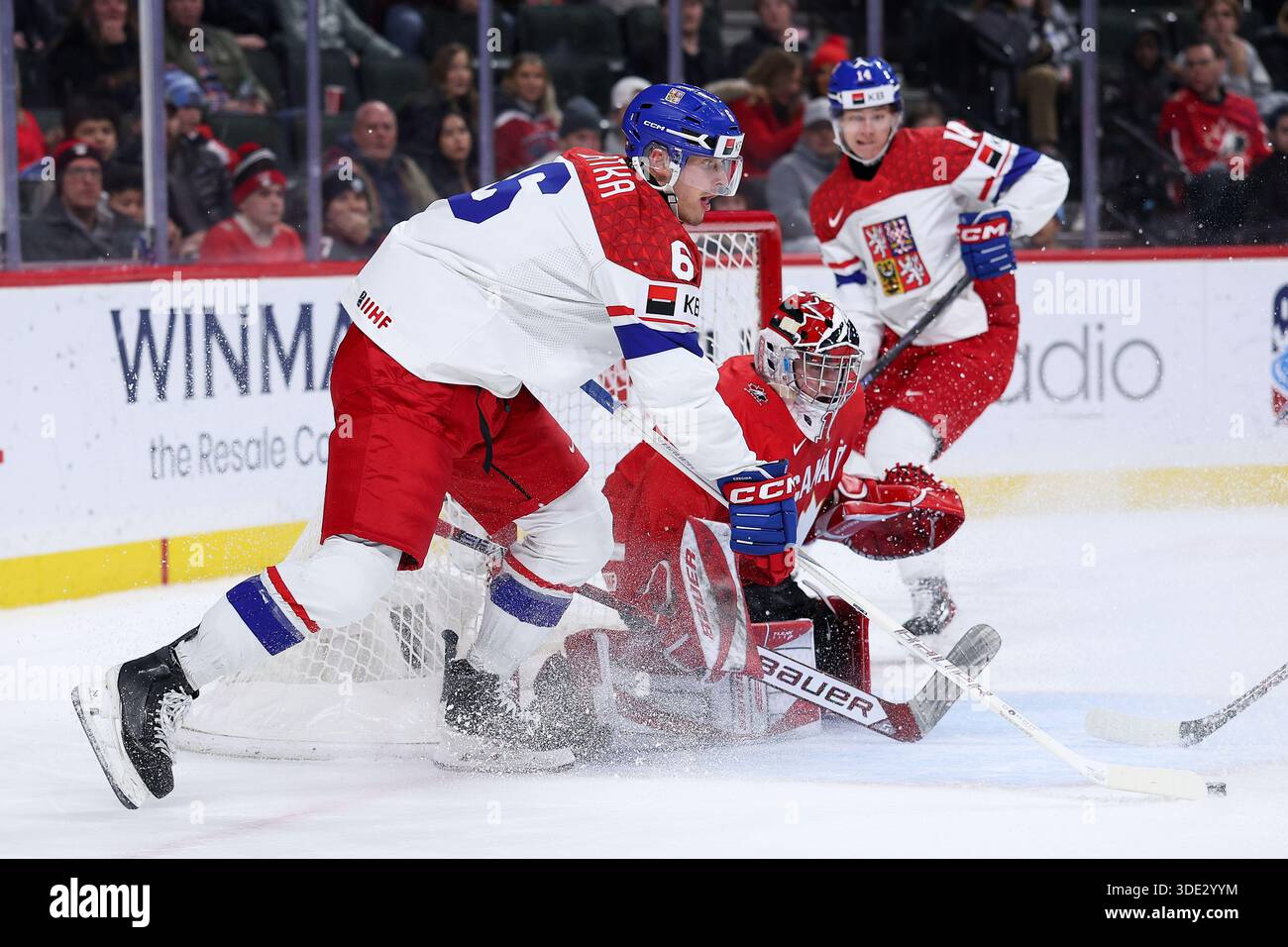 Czechia defense Radim Mrtka passes the puck as Canada goalie Jack ...