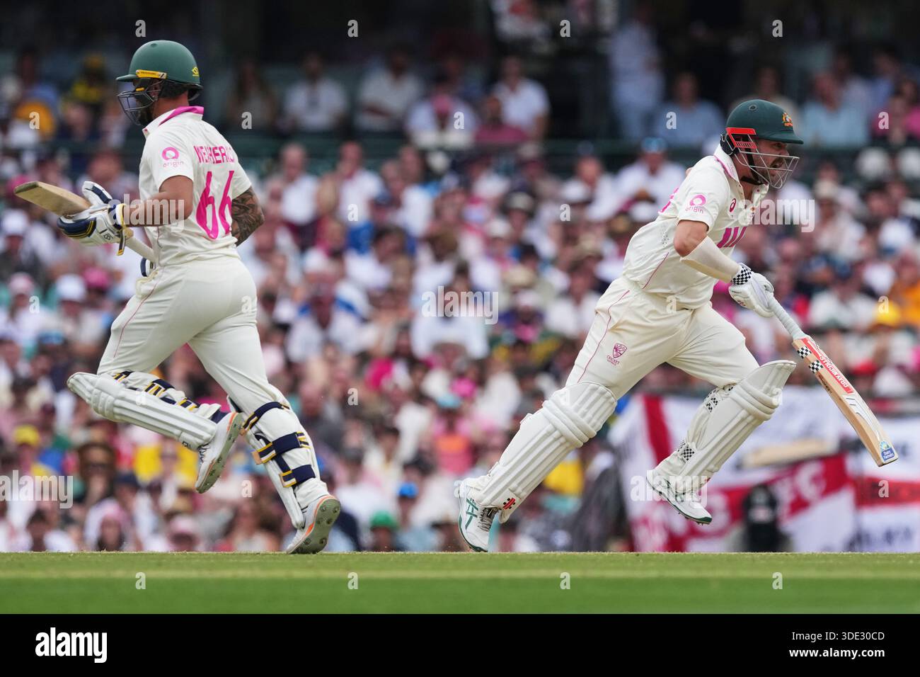 Australia's Travis Head and teammate Jake Weatherald, left, run between ...