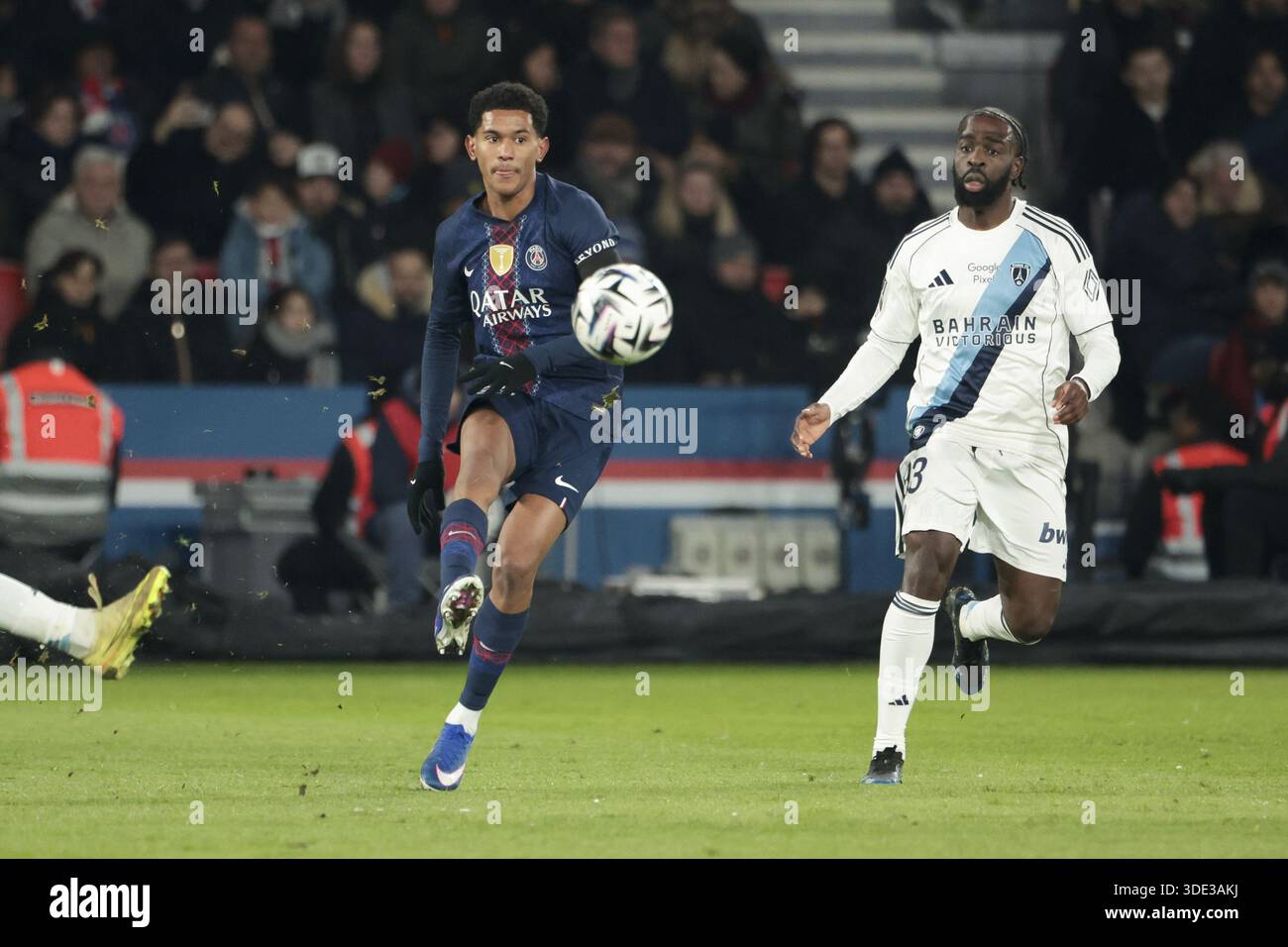 Senny Mayulu of PSG, Jonathan Ikone of Paris FC during the French ...