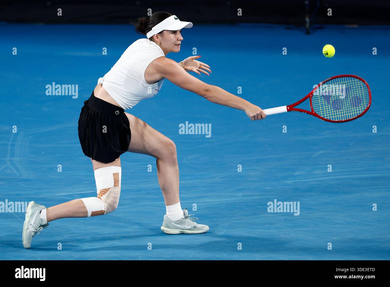 Eva Lys of Team Germany plays a forehand in her Group F singles match ...
