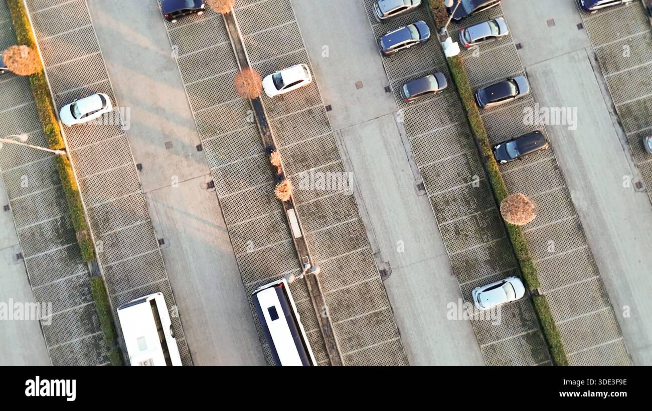 An overhead perspective captures a sprawling parking area filled with ...