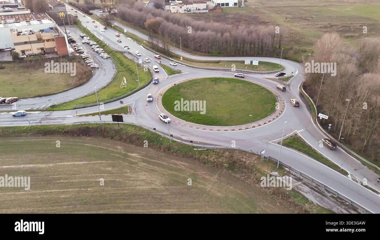 An elevated perspective captures vehicles circulating through a modern ...