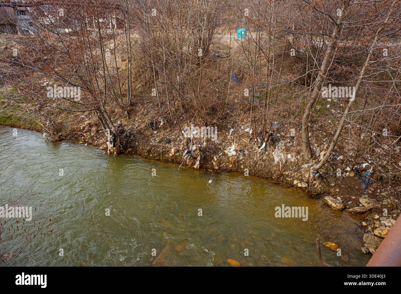 Polluted River with Floating Trash and Oil Slicks in Natural Setting ...