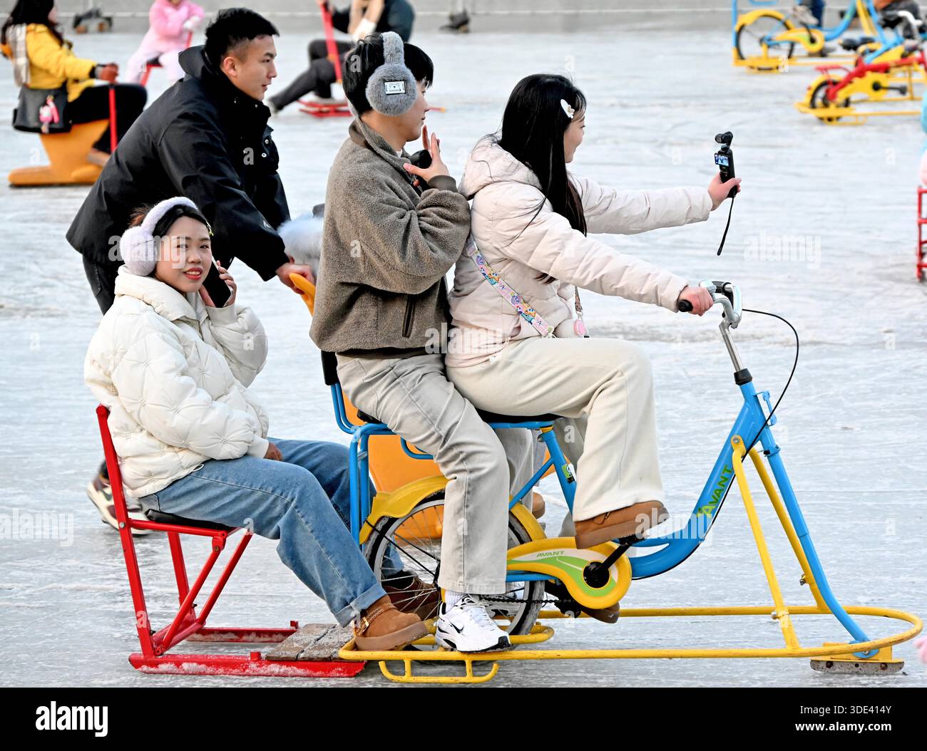 Visitors enjoy various winter sports at Xiuchi Ice Rink in Shougang ...