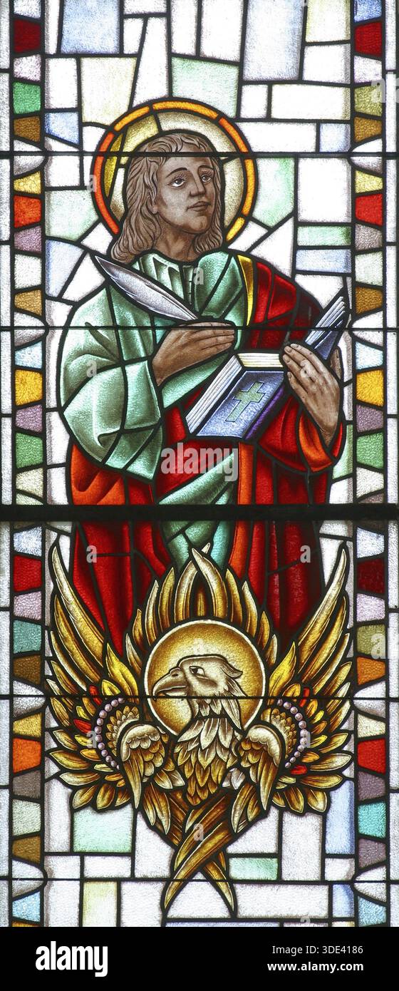 St john the evangelist stained glass hi-res stock photography and ...
