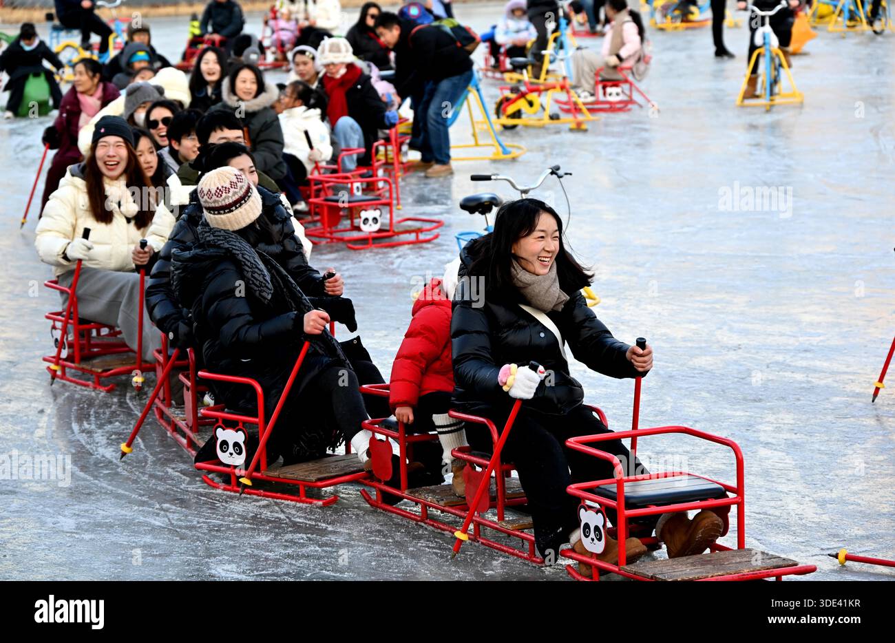 Visitors enjoy various winter sports at Xiuchi Ice Rink in Shougang ...