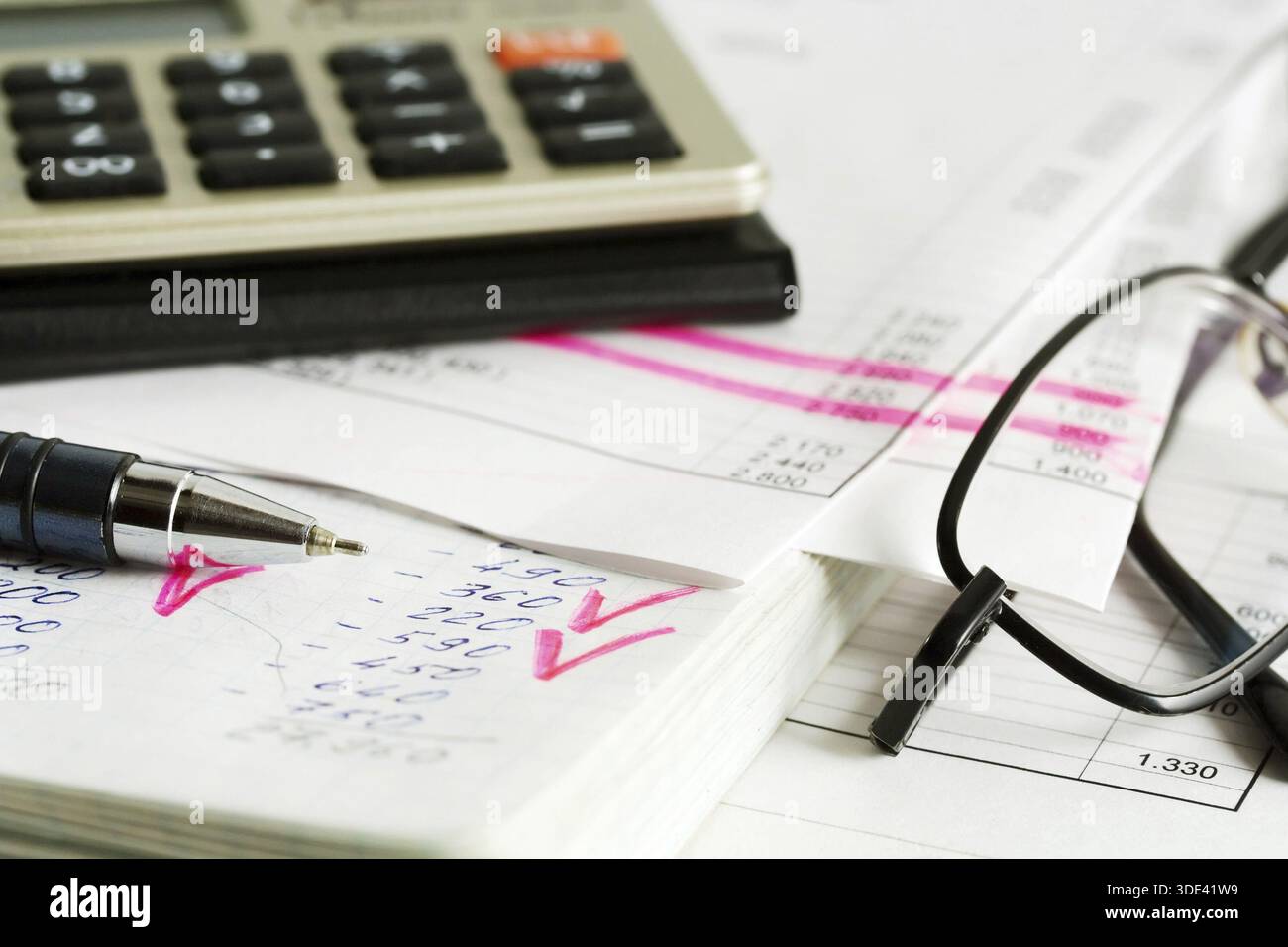 On reports calculator glasses hi-res stock photography and images - Alamy