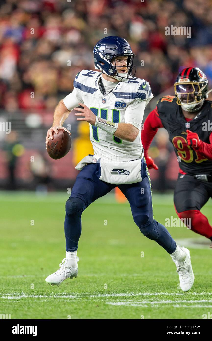 Seattle Seahawks quarterback Sam Darnold (14) scrambles against the San ...