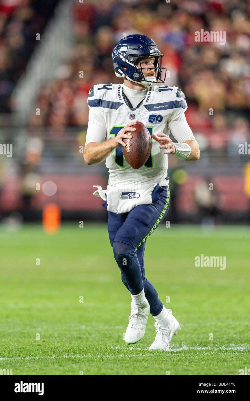 Seattle Seahawks quarterback Sam Darnold (14) scrambles against the San ...