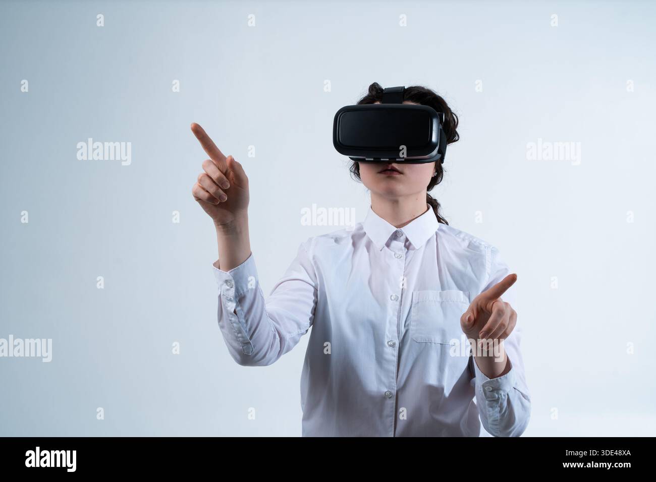 Female user navigating a virtual system with hand gestures using VR ...