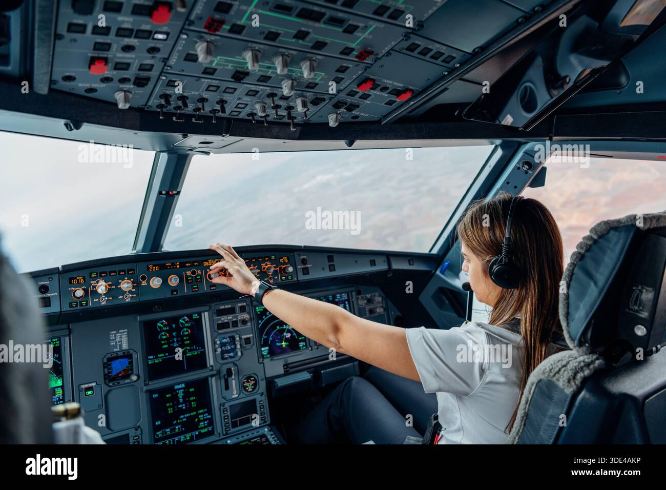 Pilot adjusting autopilot controls hi-res stock photography and images ...