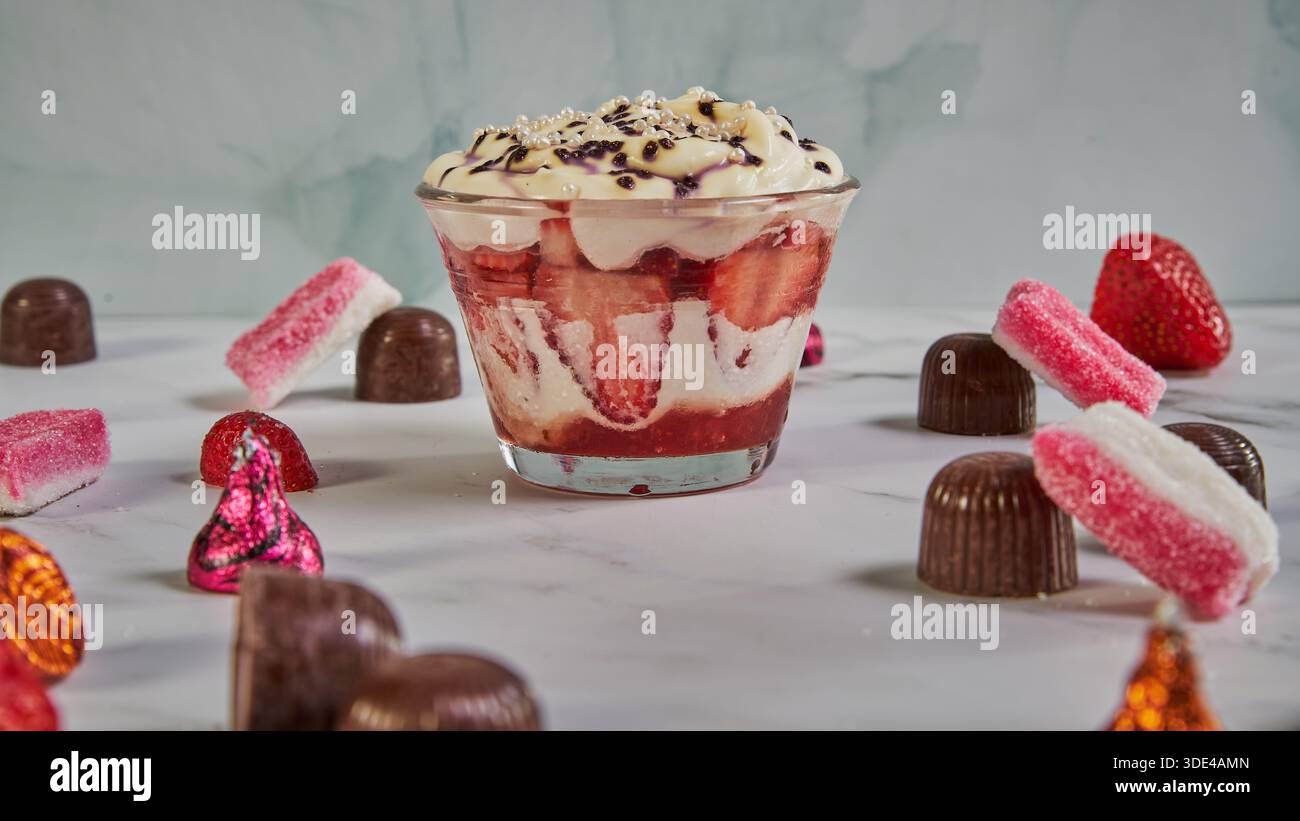 Strawberry Cream Dessert Surrounded by Sweets Stock Photo - Alamy