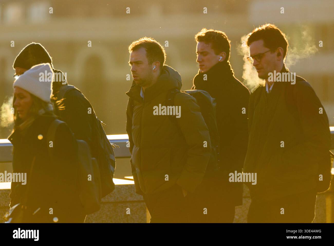 05/01/2026. London, UK. Commuters walk across London Bridge during the ...