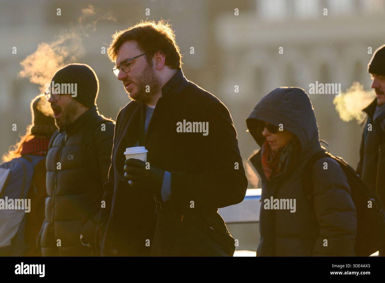 05/01/2026. London, UK. Commuters walk across London Bridge during the ...