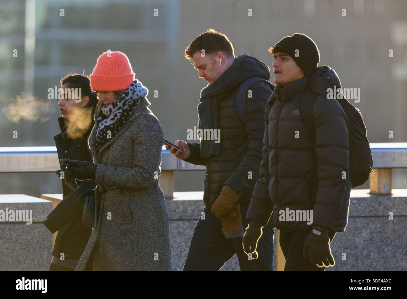 05/01/2026. London, UK. Commuters walk across London Bridge during the ...