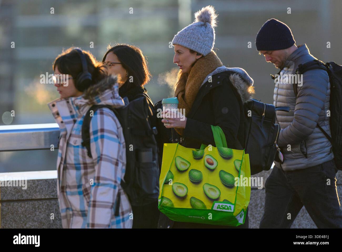 05/01/2026. London, UK. Commuters walk across London Bridge during the ...