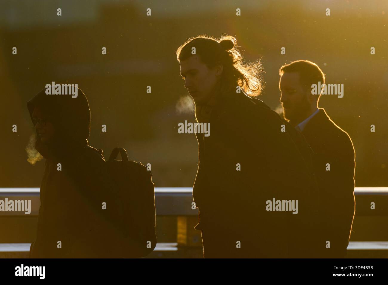 05/01/2026. London, UK. Commuters walk across London Bridge during the ...