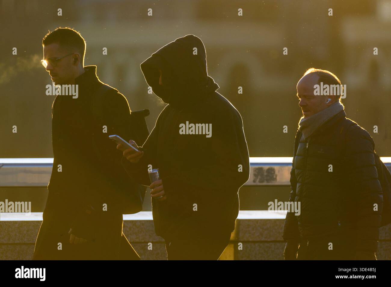 05/01/2026. London, UK. Commuters walk across London Bridge during the ...