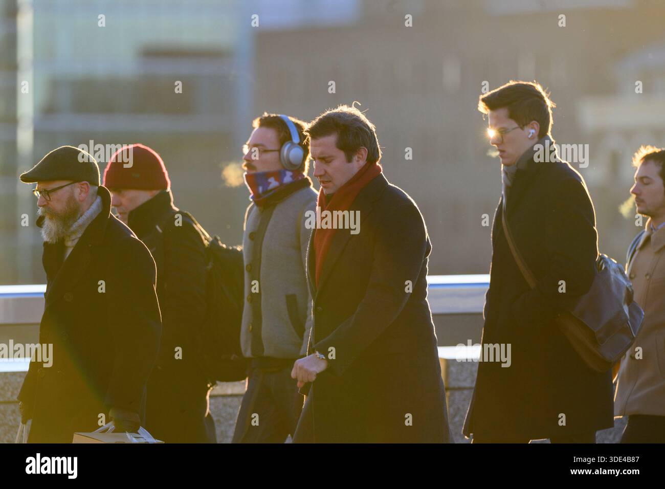 05/01/2026. London, UK. Commuters walk across London Bridge during the ...