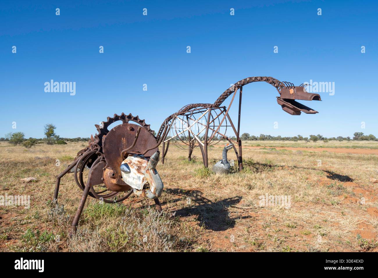 Dinosaur sculpture made from scrap metal in field on outskirts of ...