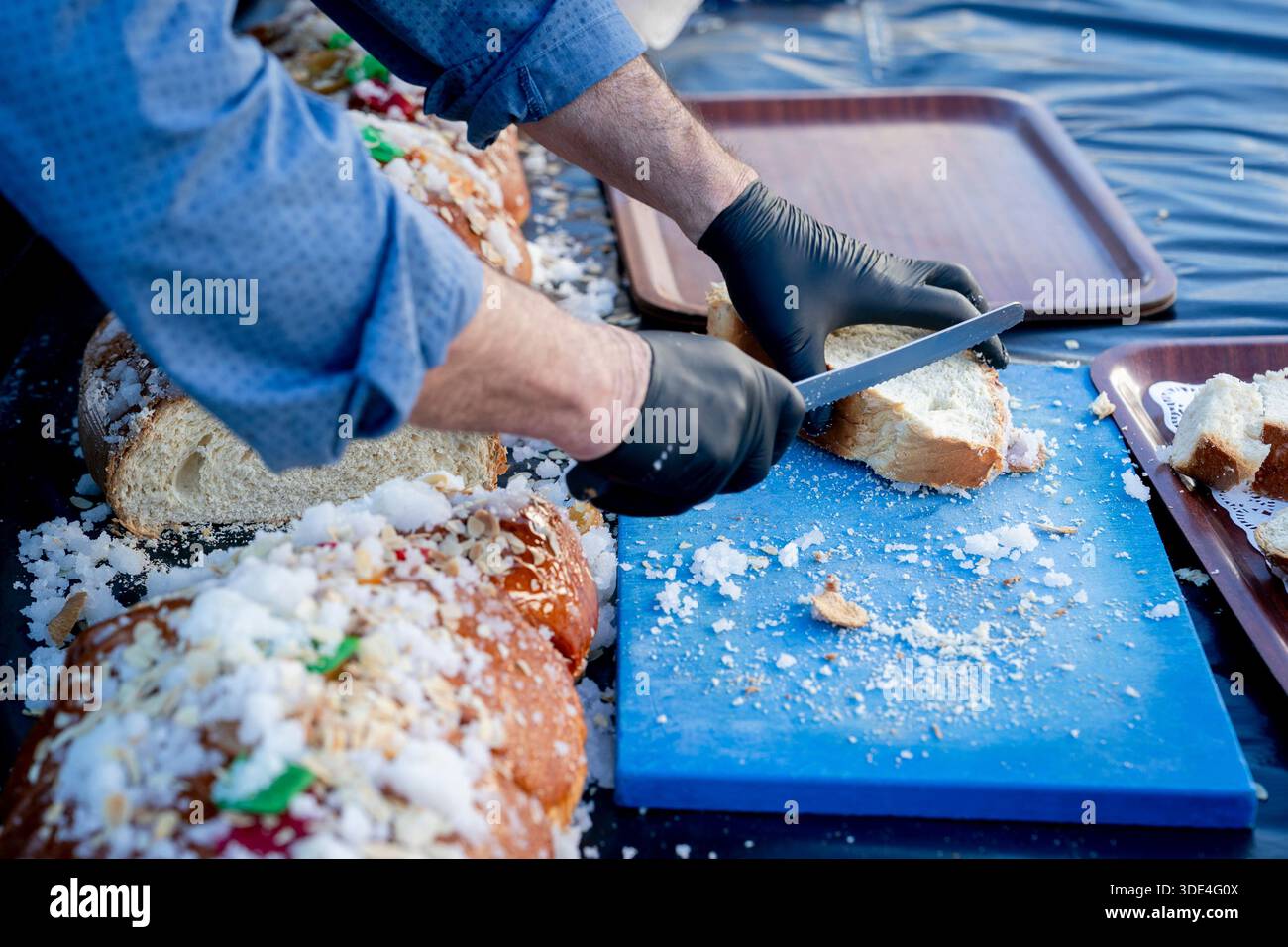 Volunteers during the distribution at Puerta del Sol of the traditional ...