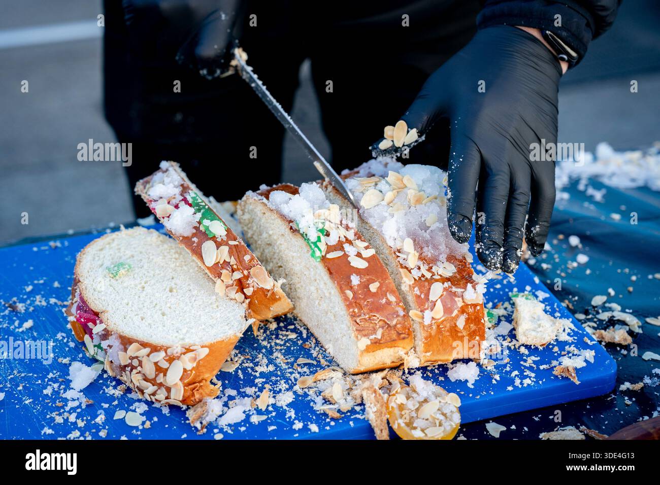Volunteers during the distribution at Puerta del Sol of the traditional ...