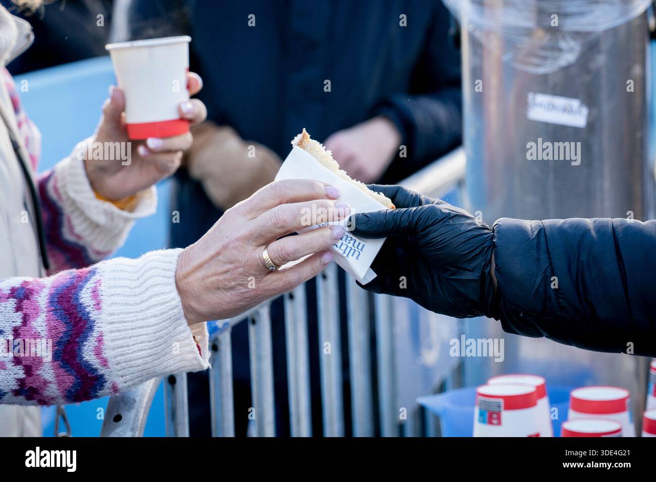 Volunteers during the distribution at Puerta del Sol of the traditional ...
