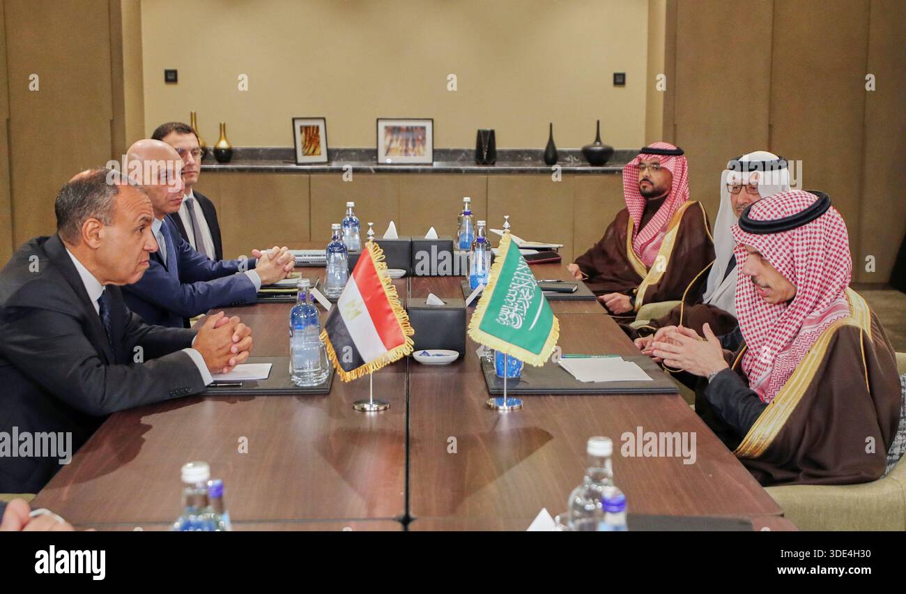 Saudi Arabia's Foreign Minister Faisal bin Farhan, right, meets with ...