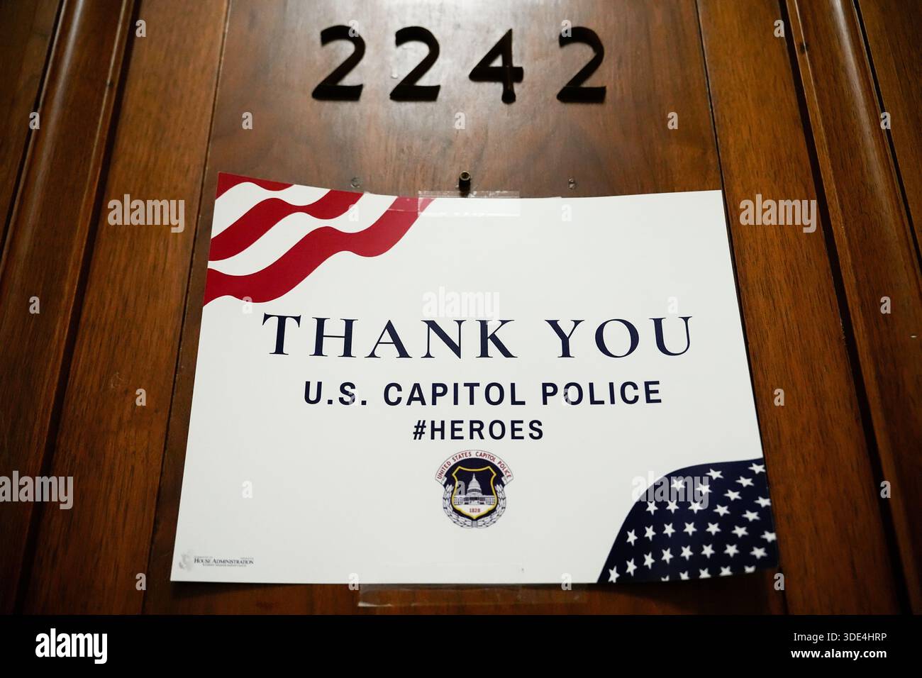 A poster thanking U.S. Capitol Police officers hangs on the office door ...