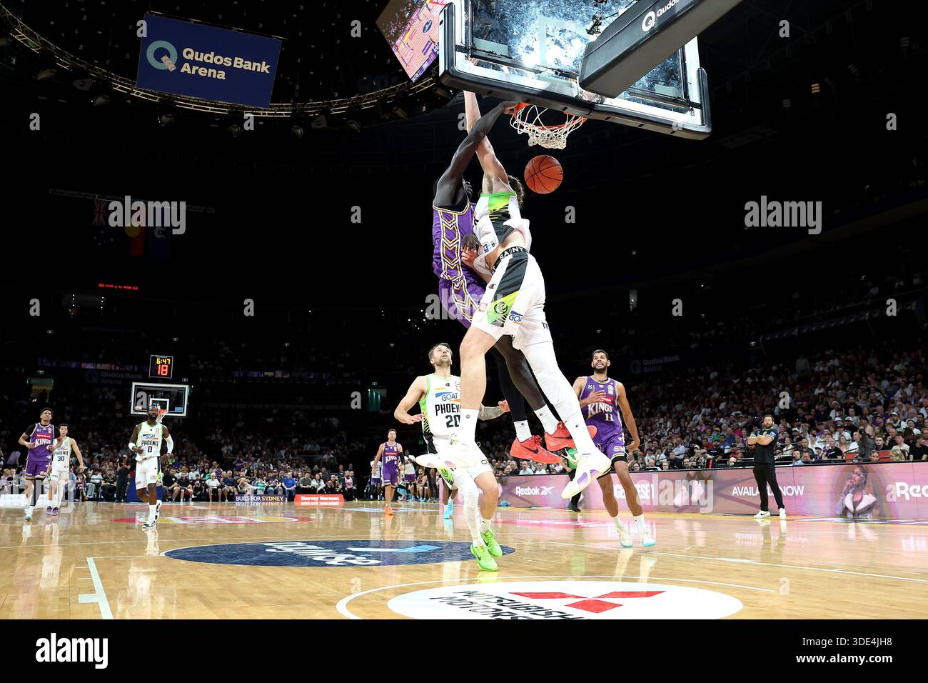 Makuach Maluach of the Kings dunks as Jordan Hunter of the Phoenix ...